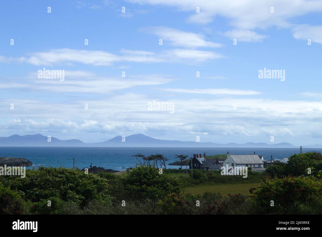 Anglesey, Wales landscape of sea and Snowdonia. Beautiful summer scene ...