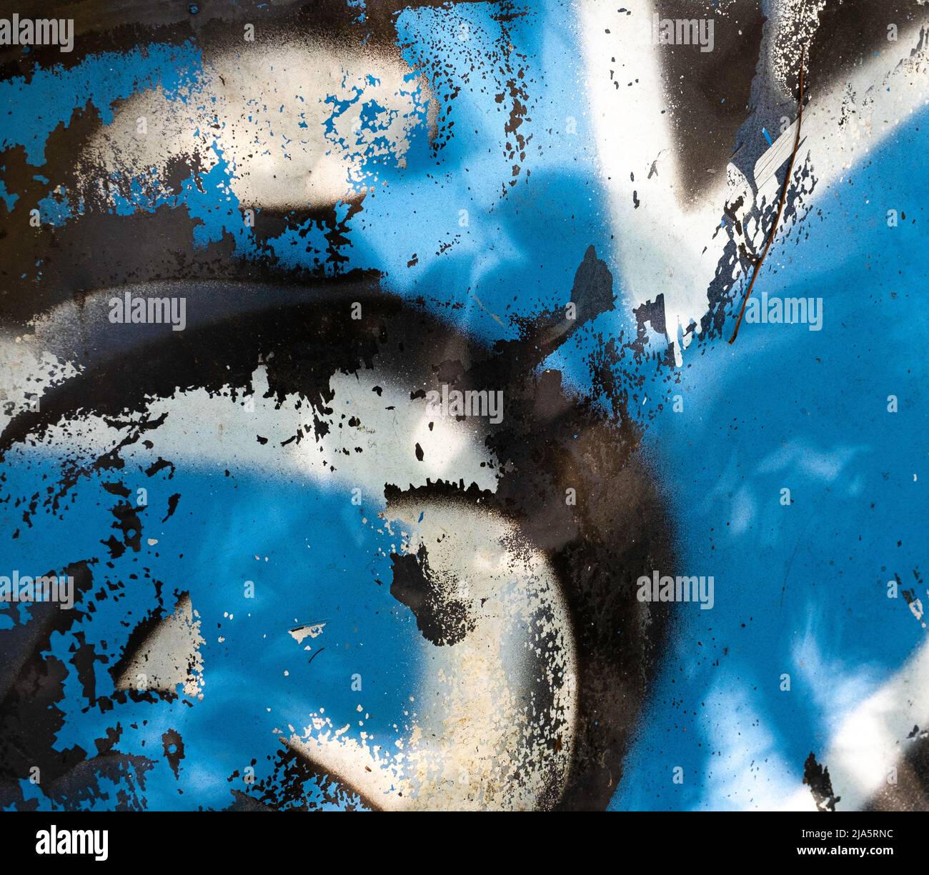 Abstract blue , white and black paint splashed on cement wall in Bali ...