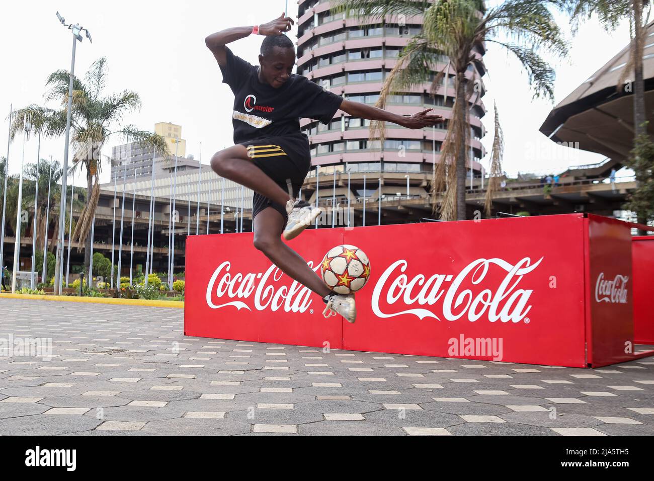 18 year old Kenyan Austin Kinoo, juggles a soccer ball, during the FIFA ...