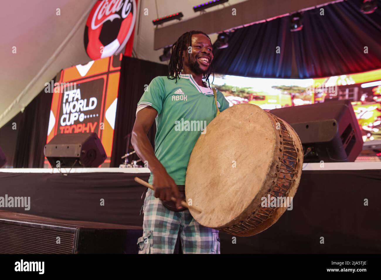 A local Kenyan soccer fan entertains other fans during the FIFA World ...