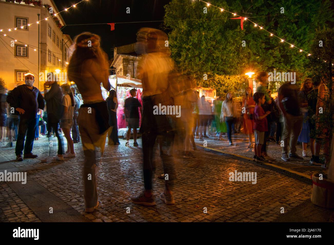 Social events at night, people enjoying the summer nights. People ...