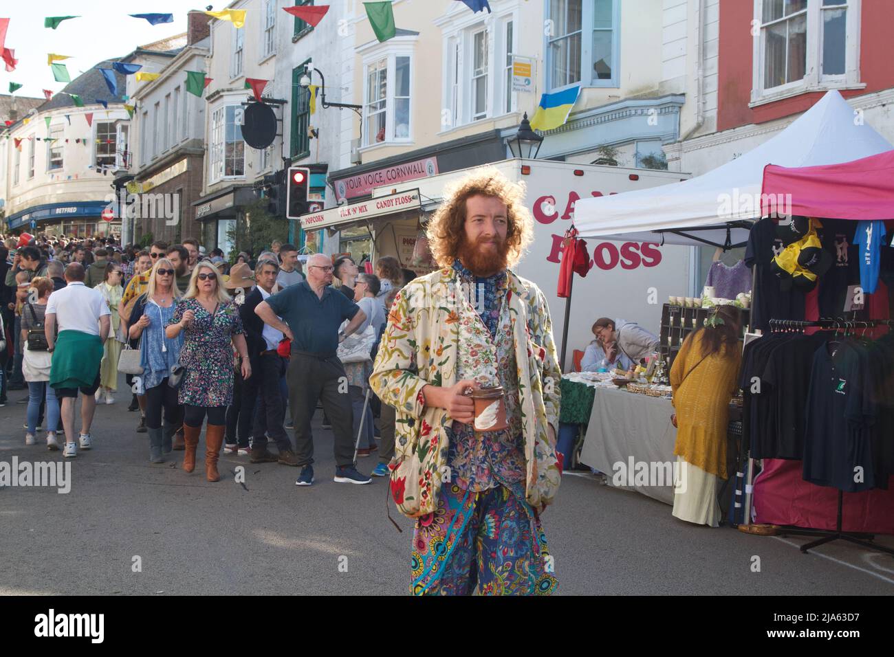 Flora Day 2022 street scene including a ginger haired man in a ...
