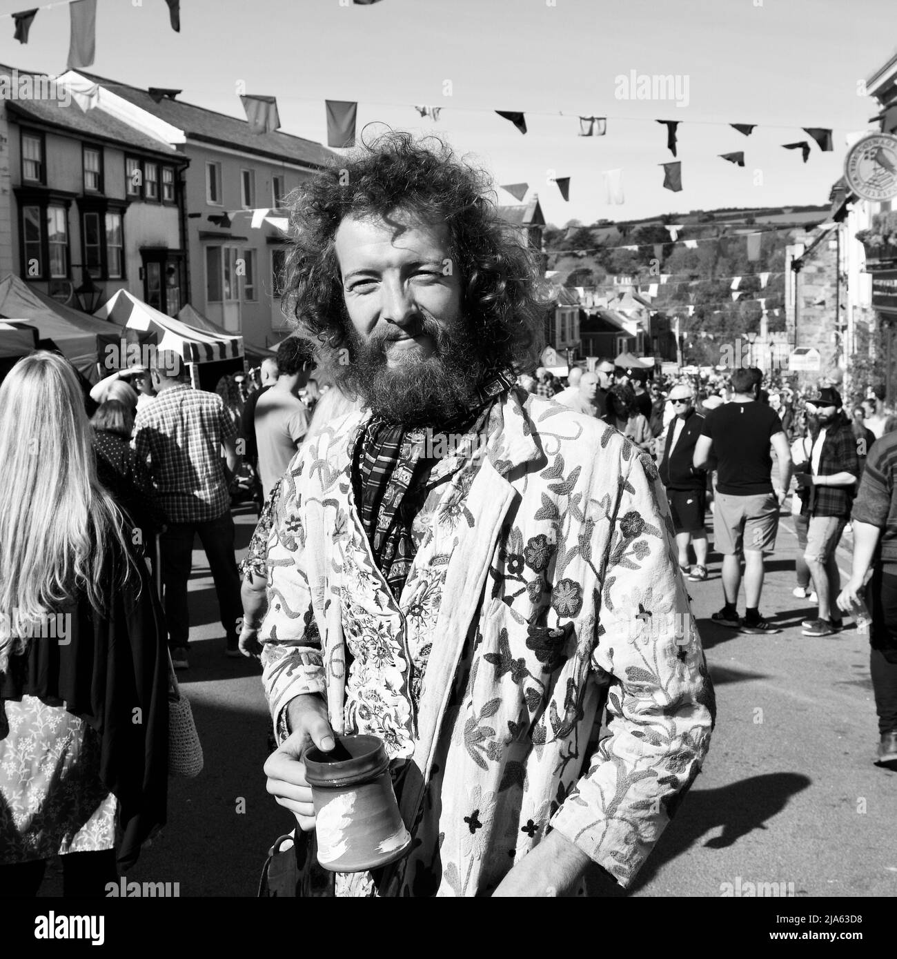Flora Day 2022 street scene including a ginger haired man in a ...