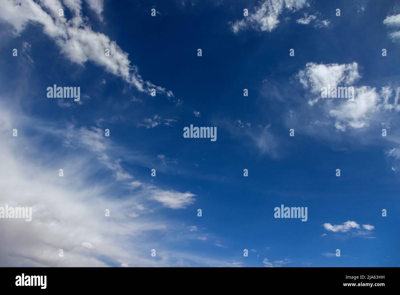 White fluffy cumulus clouds flying, blue sky at fast moving cloud Stock ...