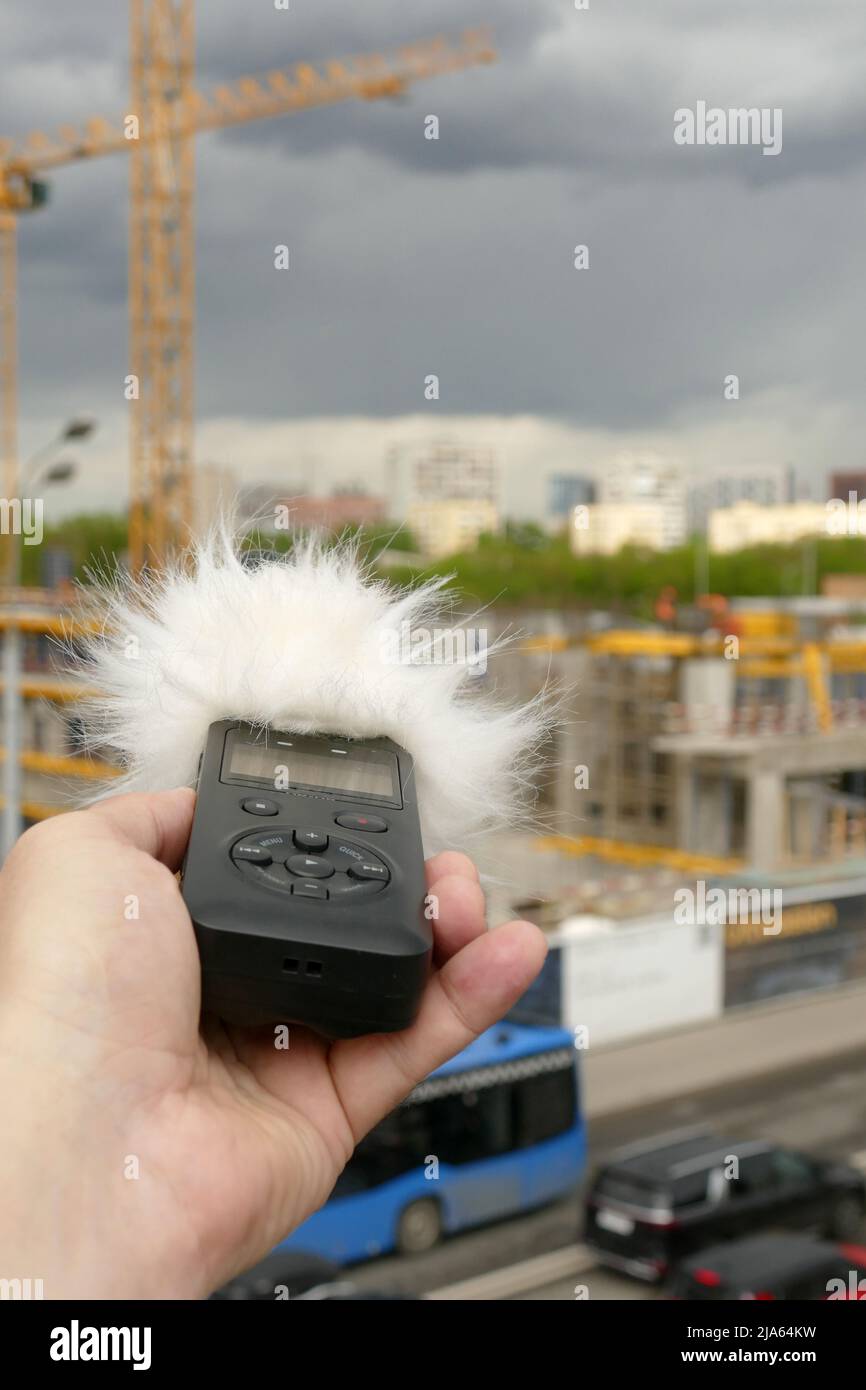 Voice recorder in hand. Recording sound effects, voice level, Noise ...