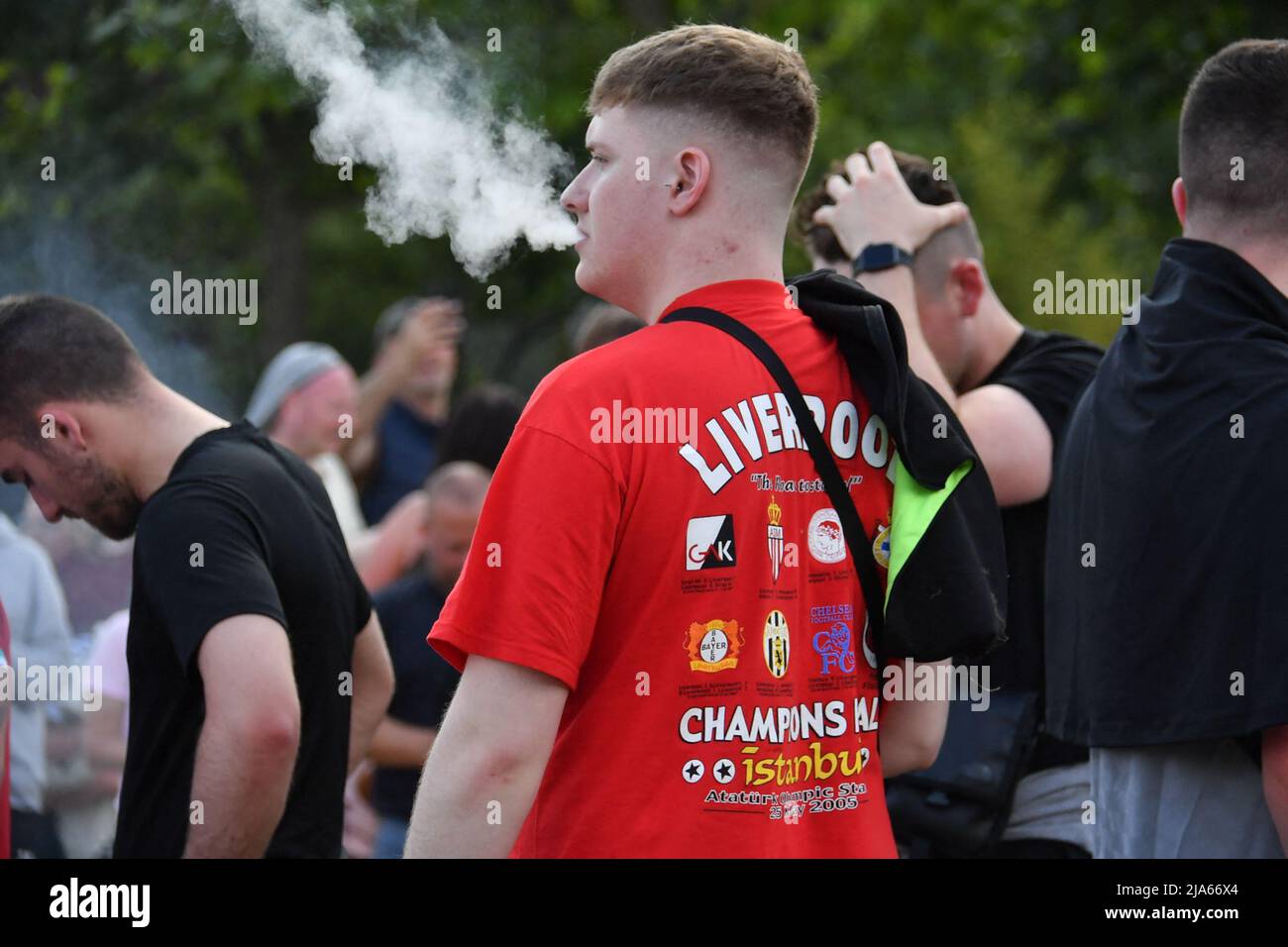 Liverpool FC's fans dance and drink near the Eiffel Tower in Paris ...