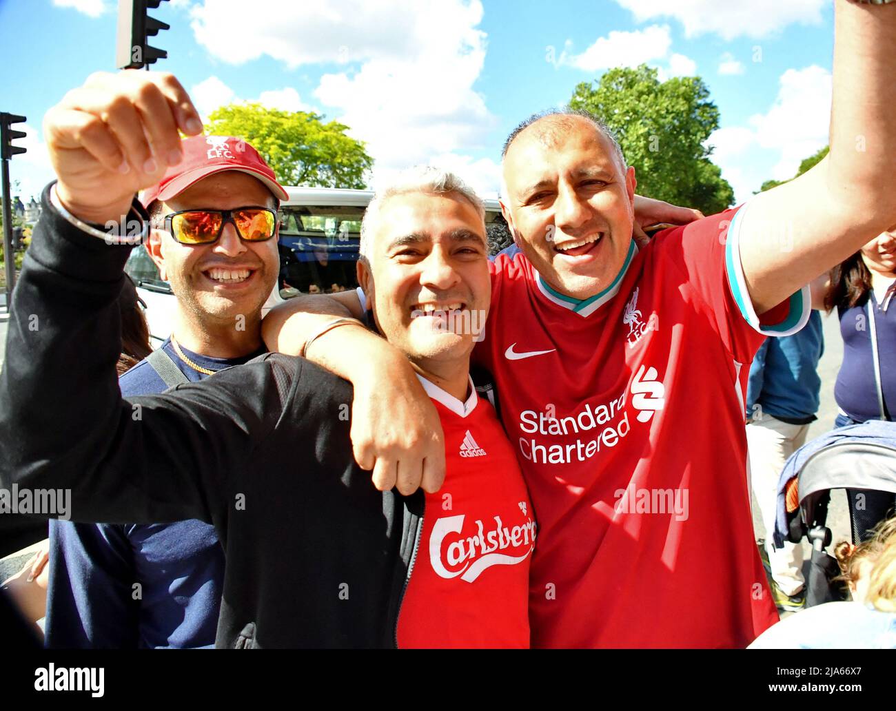 Liverpool FC's fans dance and drink near the Eiffel Tower in Paris ...