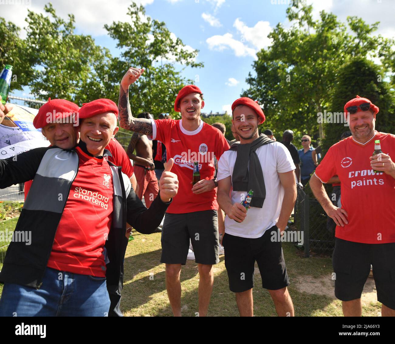 Liverpool FC's fans dance and drink near the Eiffel Tower in Paris ...