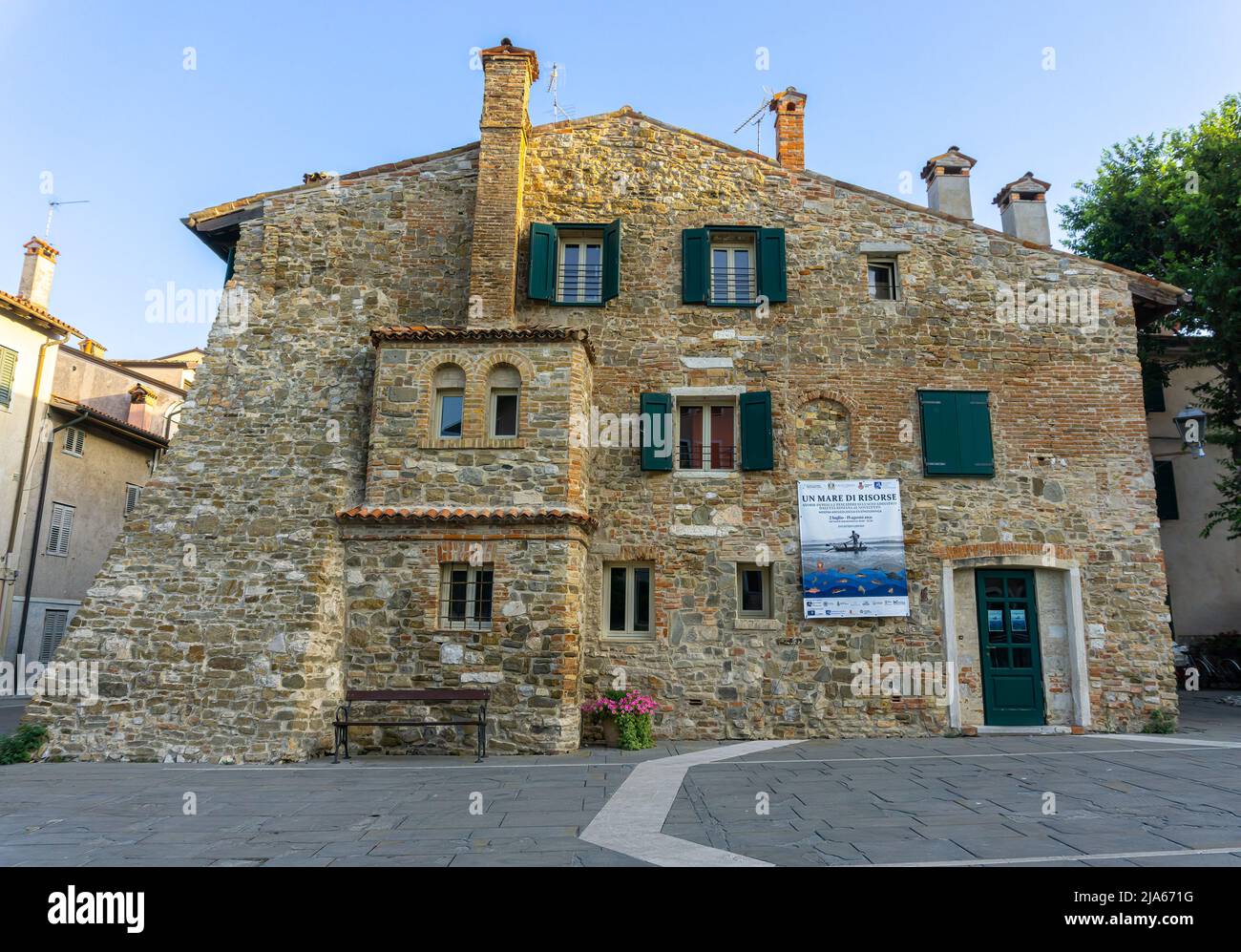 Grado, Italy - July 8, 2021: A traditional brick house in Italian style ...