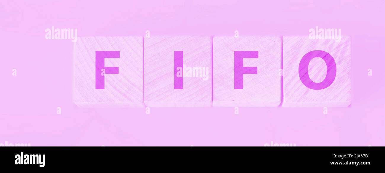 FIFO First in, first out word on wooden cubes on a blue background ...