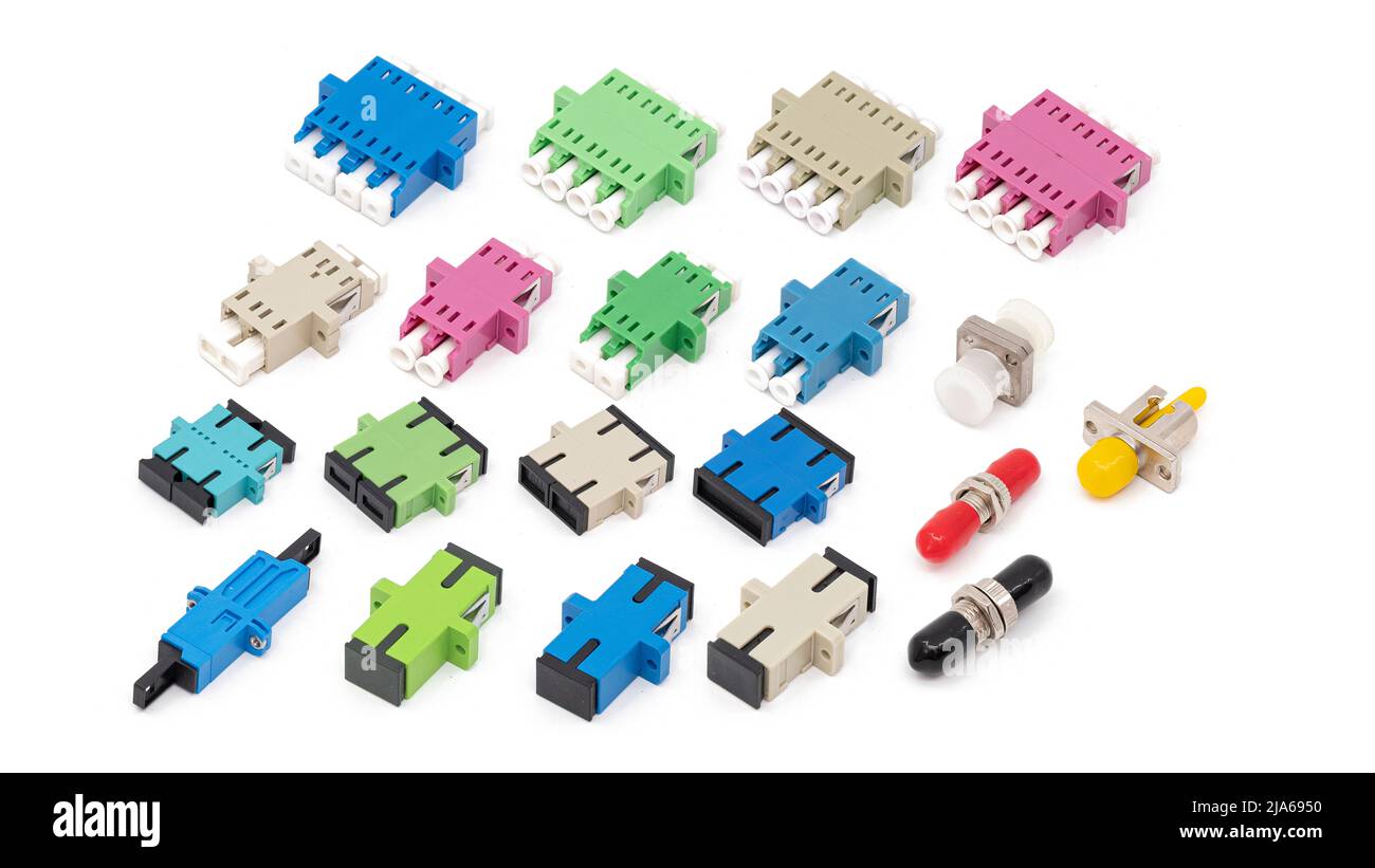 fiber optic adapters on isolated white background Stock Photo - Alamy
