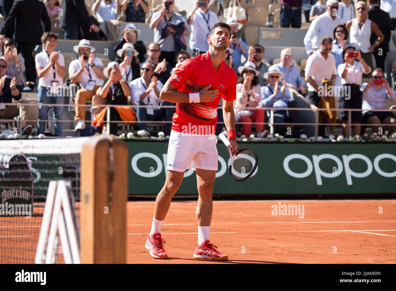 Novak Djokovic playing during French Open Tennis at Roland Garros arena ...