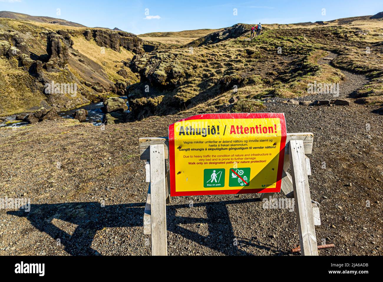 Warning sign at Skógafoss waterfall, Iceland Stock Photo - Alamy