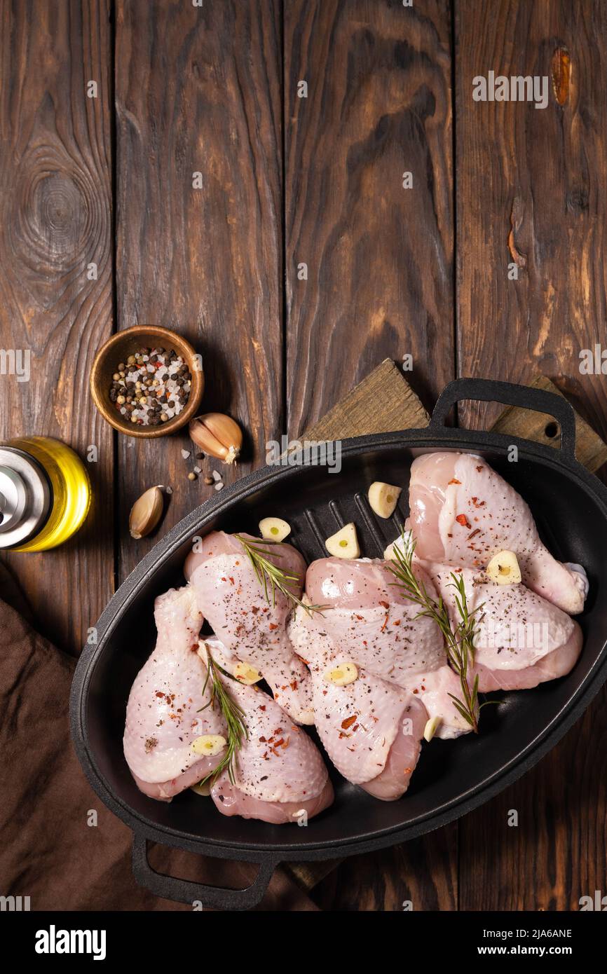 Raw chicken meat. Uncooked chicken legs on wooden cooking table ...