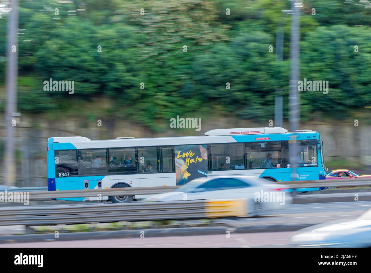 A blue and white former State owned, now outsource run, commuter bus ...