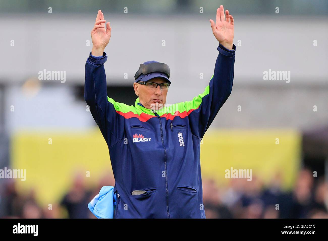 Umpire Neil Mallender signals another six Stock Photo - Alamy