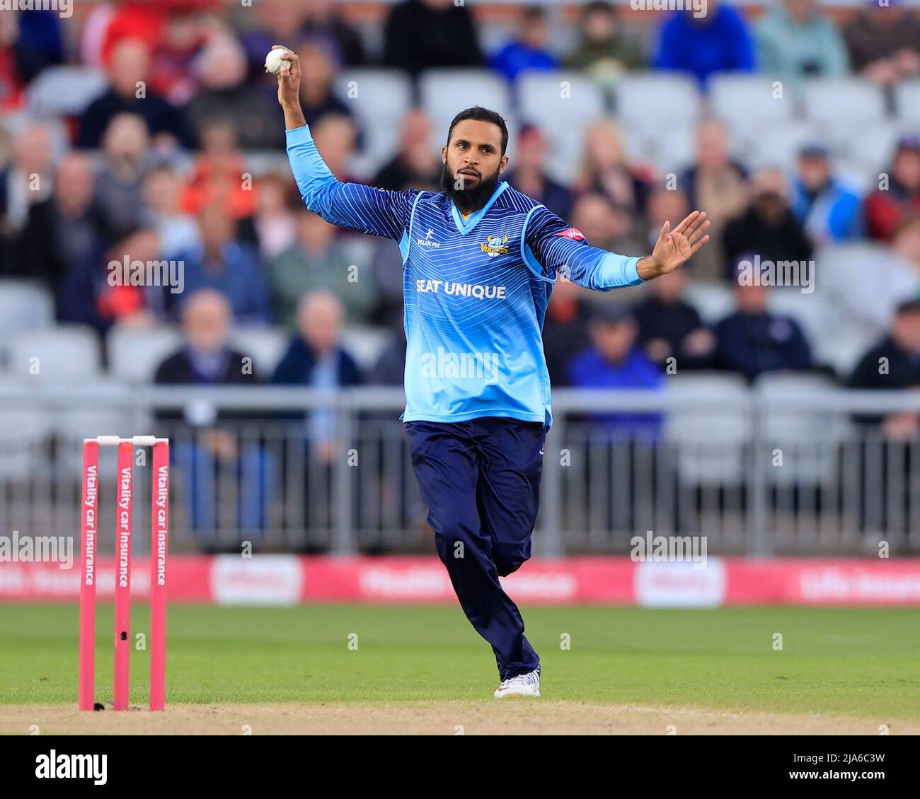 Adil Rashid bowling for Yorkshire Vikings Stock Photo - Alamy
