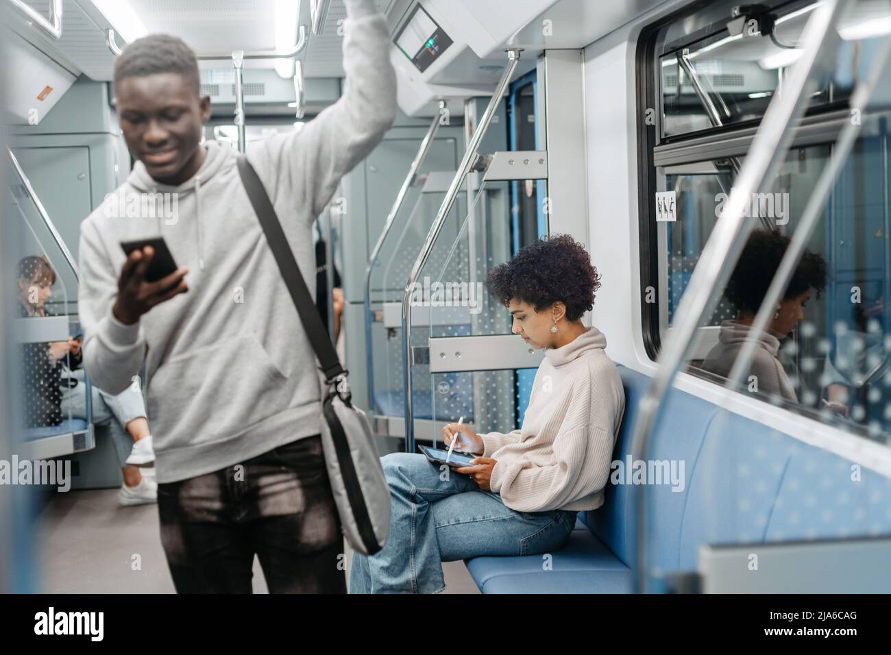 Man reading in subway car hi-res stock photography and images - Alamy
