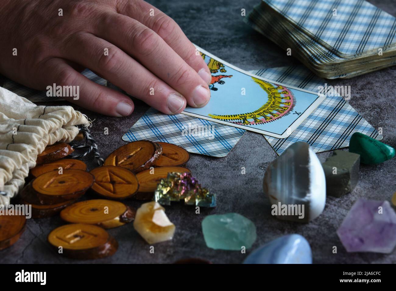 wooden runes and tarot cards on the table Stock Photo - Alamy