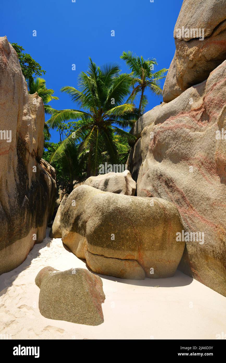 Tropical beach with big granite boulders on Coco Island, Indian ocean ...