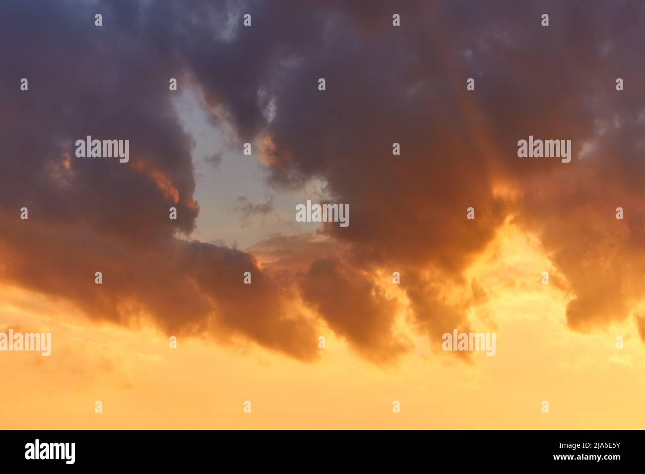 sunset sky with the light of the sun behind Stock Photo - Alamy