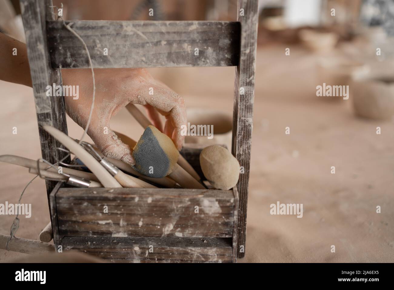 modeling tools in a wooden box. Pottery, ceramic art concept. female ...