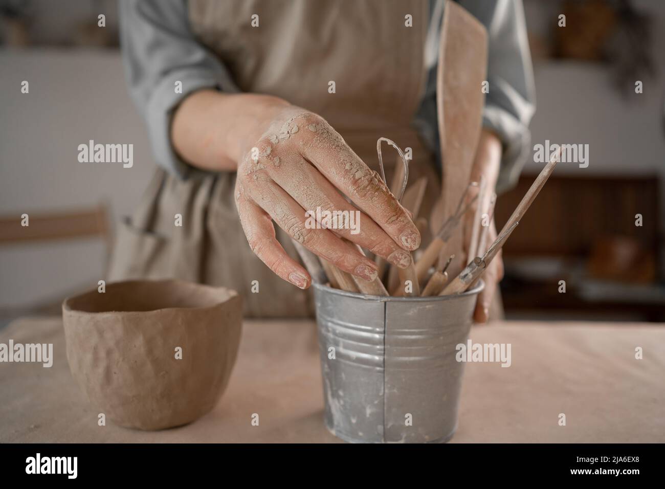 Ceramic tool. Ceramic work tools in an art workshop. the hands of the ...