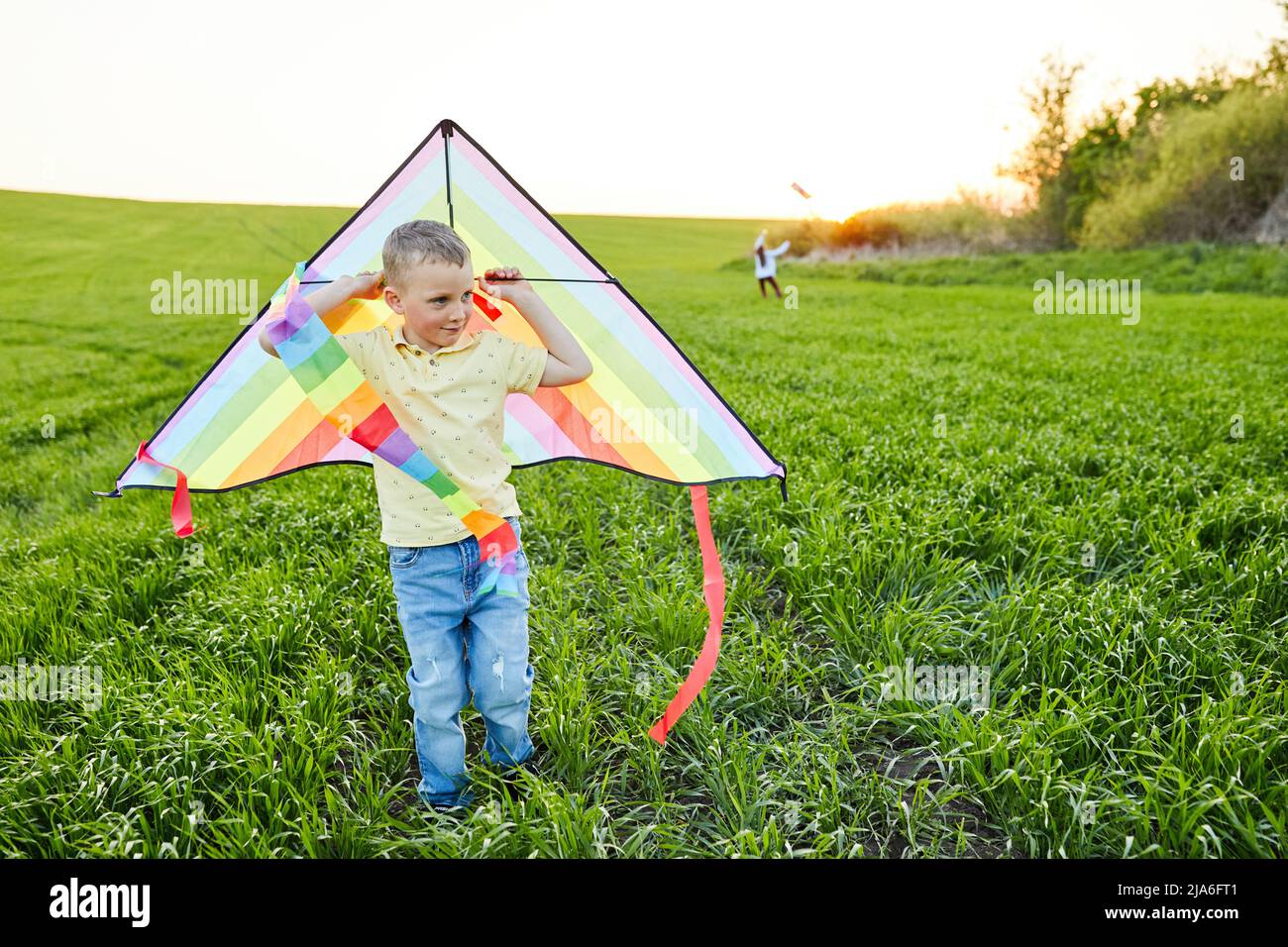Child running summer kite hi-res stock photography and images - Alamy