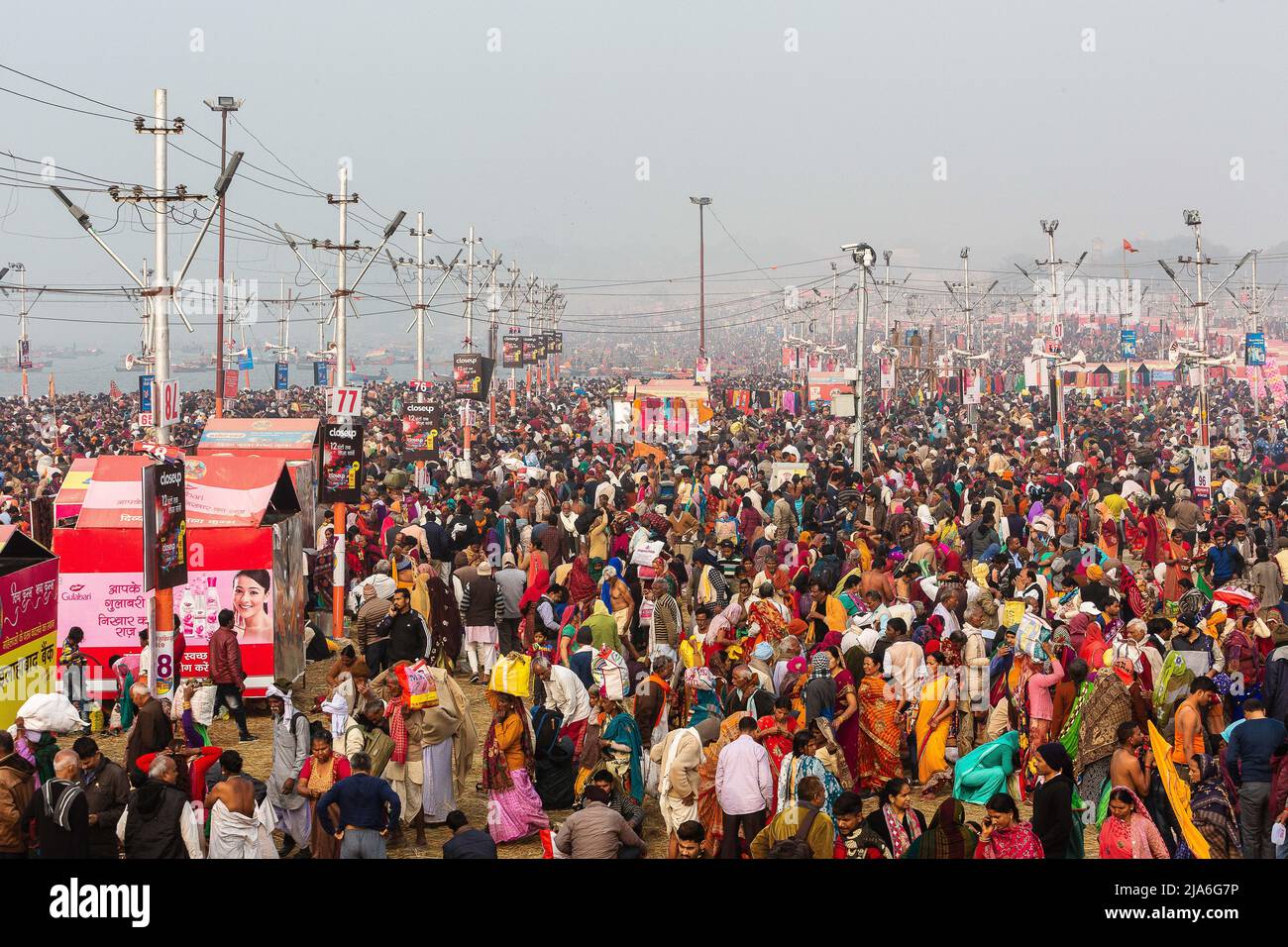 Thousands of pilgrims on the banks of the Ganges river prepare to bathe ...