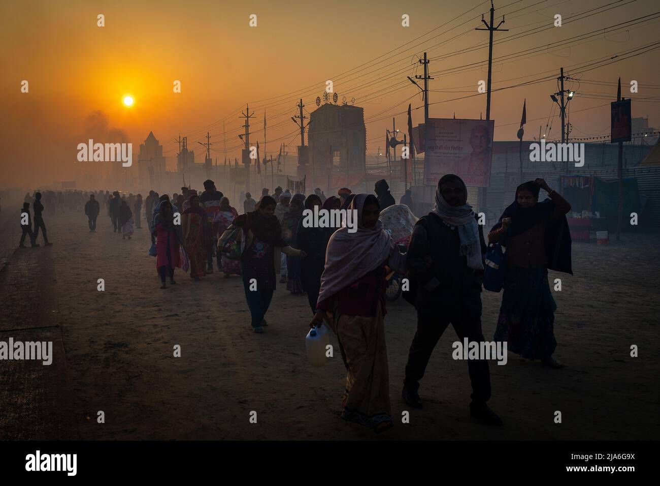 Pilgrims arrive on the early hours of the day at the Kumbh Mela ...