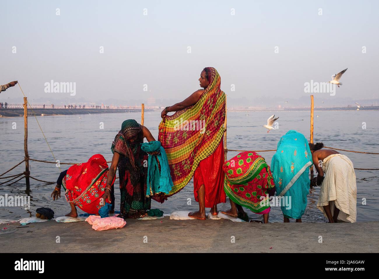 Pilgrims prepare to bathe in the holy waters of the Ganges river during ...