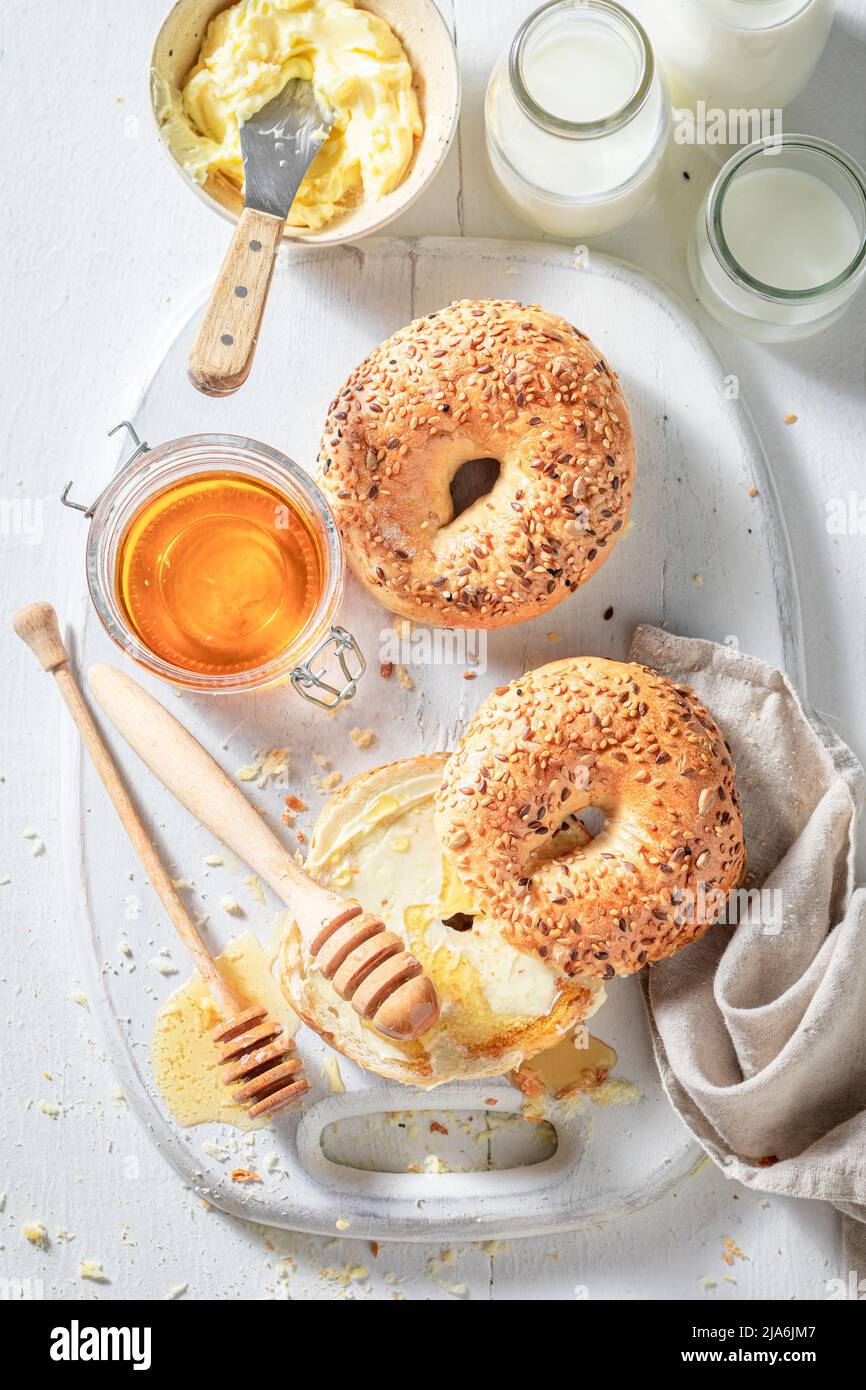Homemade and sweet golden bagels on white board. Freshly baked sweet ...