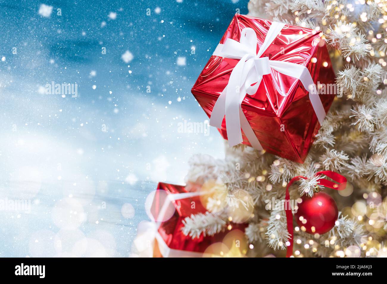Magically decorated Christmas Tree with balls, ribbons and garlands on ...