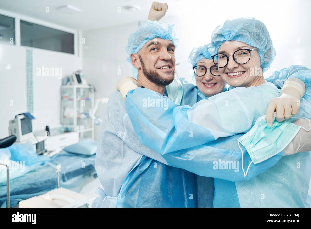 Doctors hugging and rejoicing at well-done surgery Stock Photo - Alamy