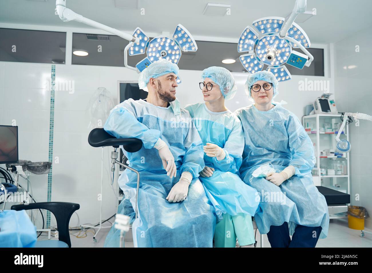 Surgeon and nurse exchanging glances on surgical table Stock Photo - Alamy