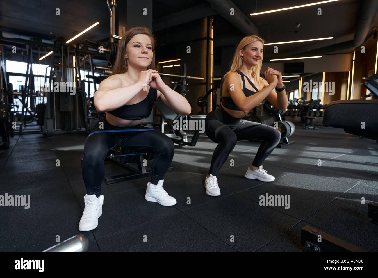 Two women perform exercise hi-res stock photography and images - Alamy