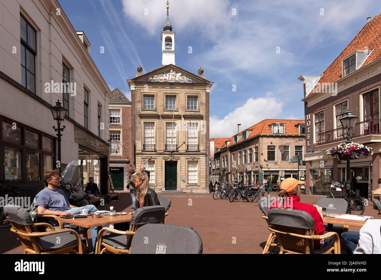 Cozy market square with a view of the former town hall of the medieval ...