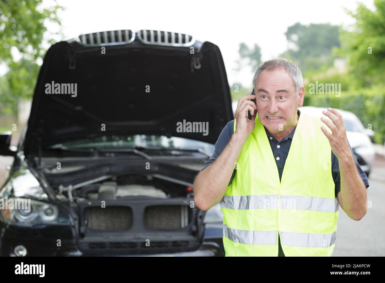 angry man a broken car calling for insurance assistance Stock Photo - Alamy