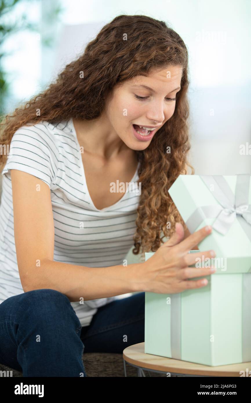 picture showing woman opening present Stock Photo - Alamy