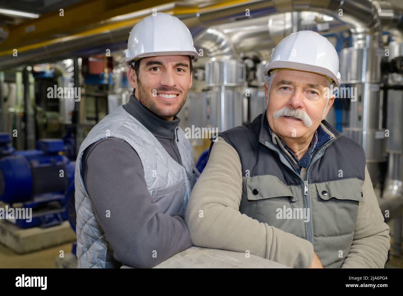 engineers posing in an industrial factory Stock Photo - Alamy