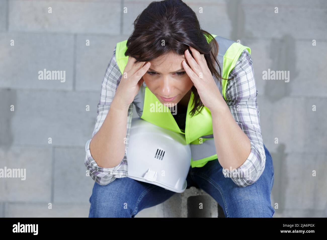female engineer or architect suffering headache Stock Photo - Alamy