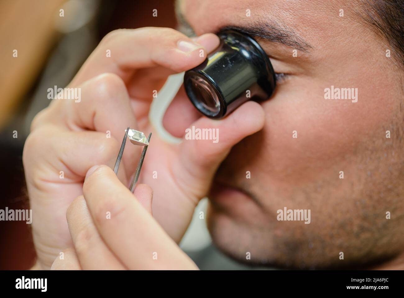 Jeweler inspecting hi-res stock photography and images - Alamy