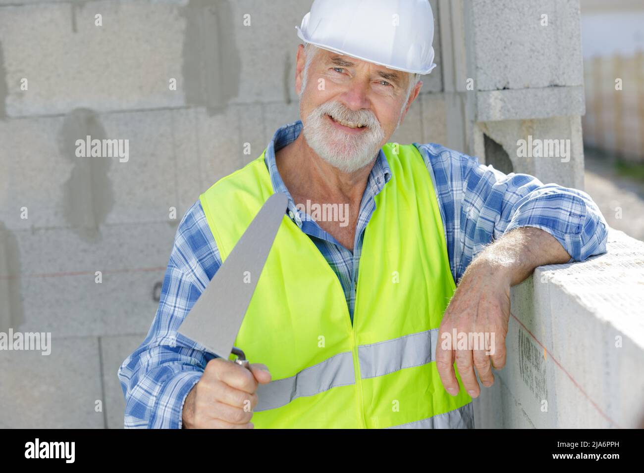 senior male bricklayer working outdoors Stock Photo - Alamy