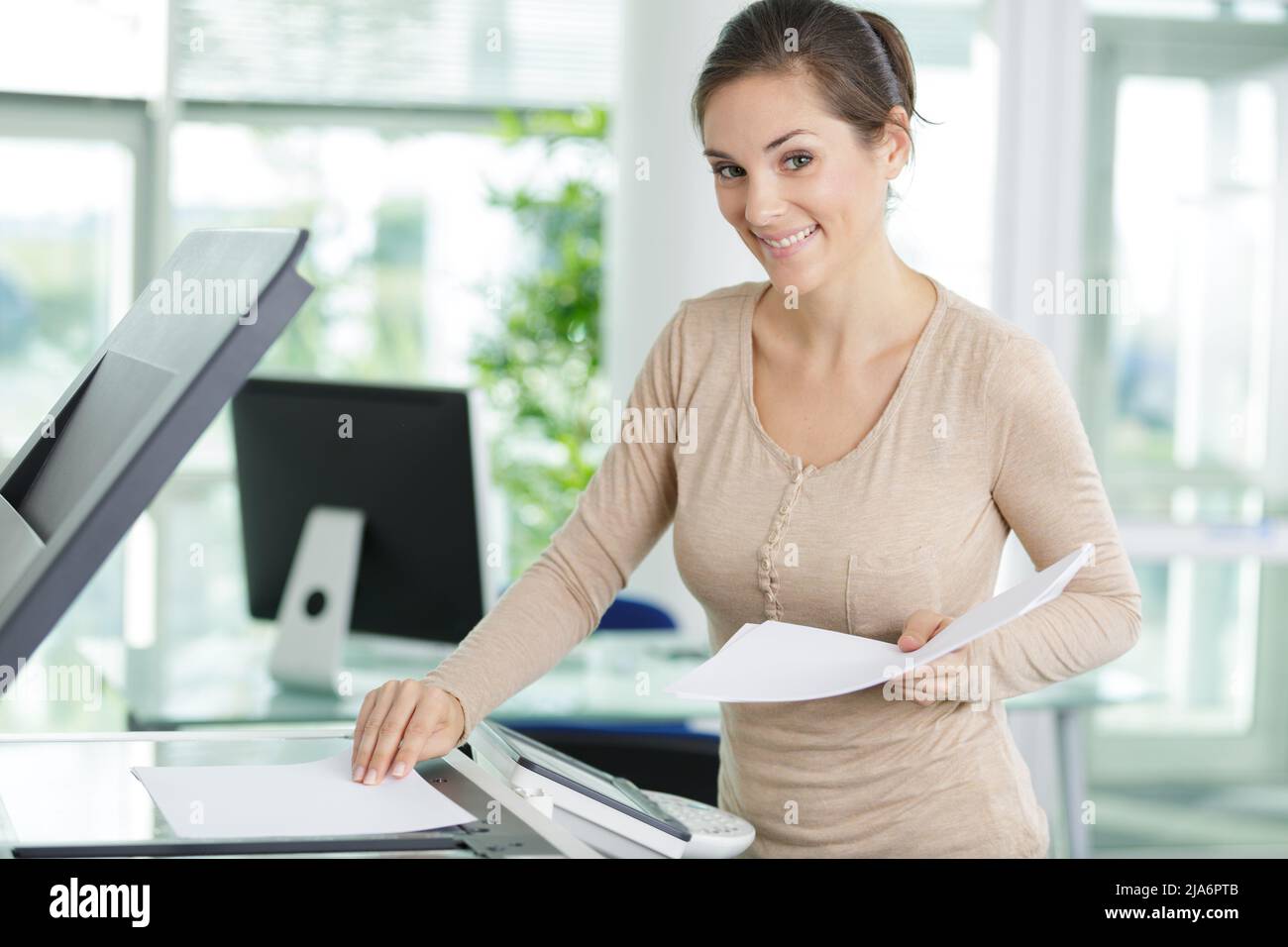portrait of a happy office worker Stock Photo - Alamy