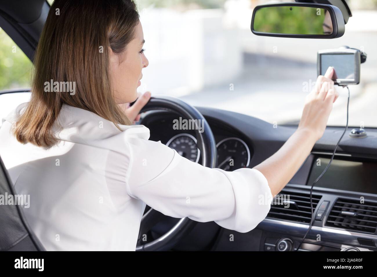 woman using gps navigation system in car Stock Photo - Alamy