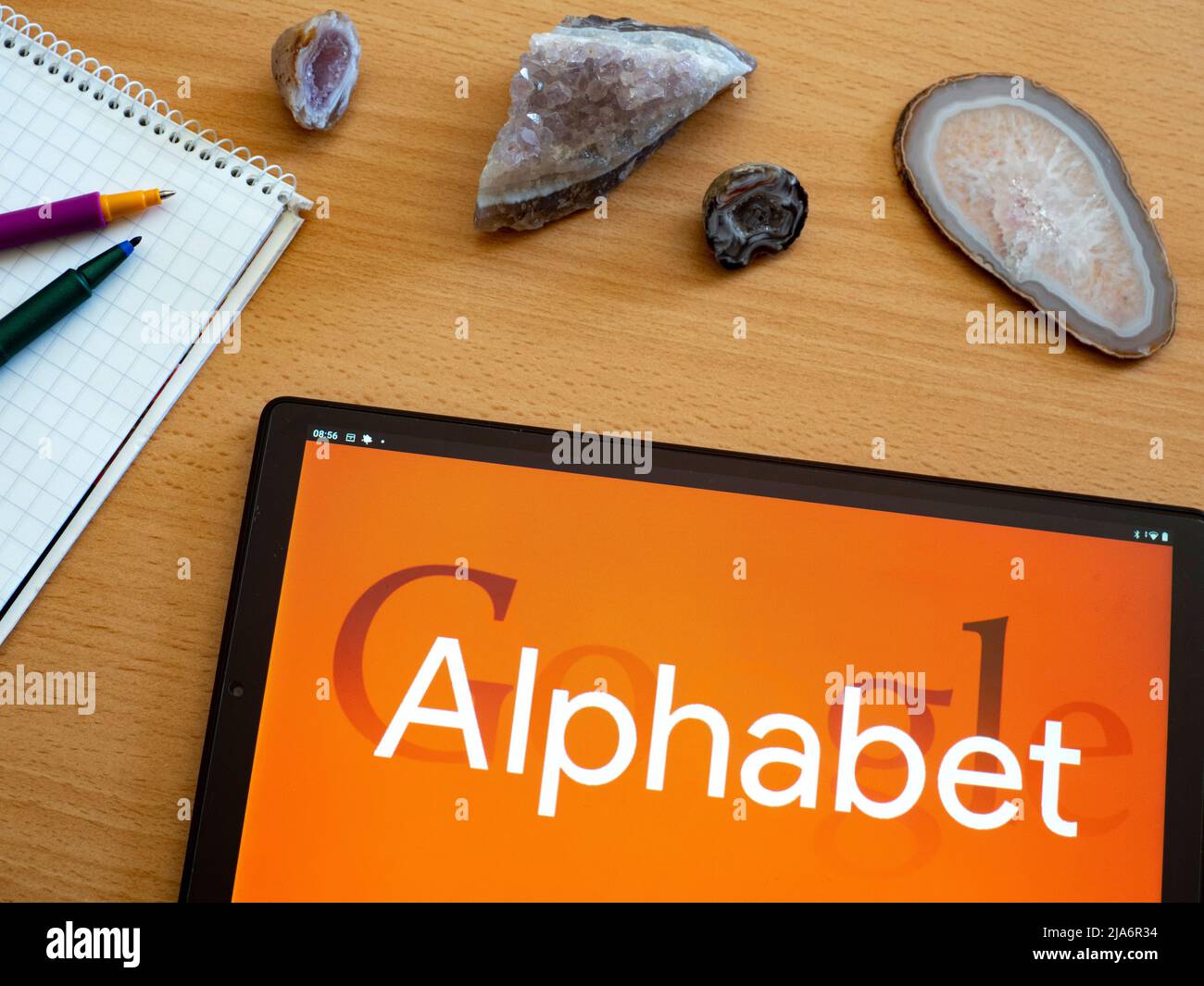 In this photo illustration Alphabet Inc. logo seen displayed on a ...