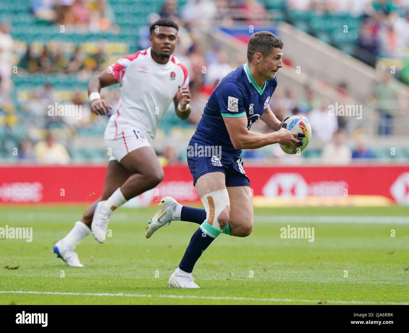 England's Api Bavadra (left) and Scotland's Robbie Ferguson in action ...