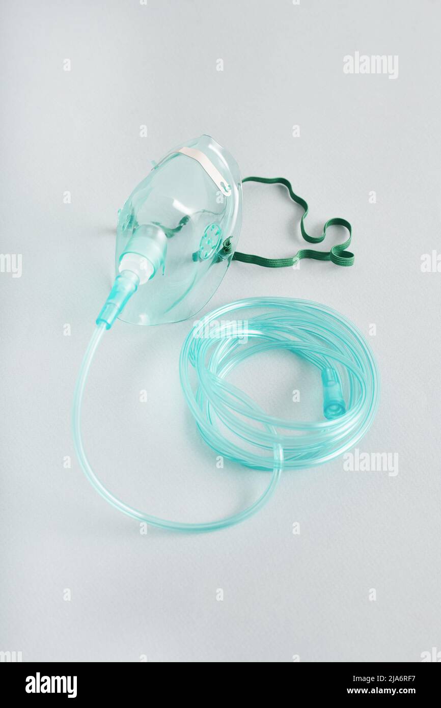 Vertical high angle shot of modern plastic respirator with tube lying ...