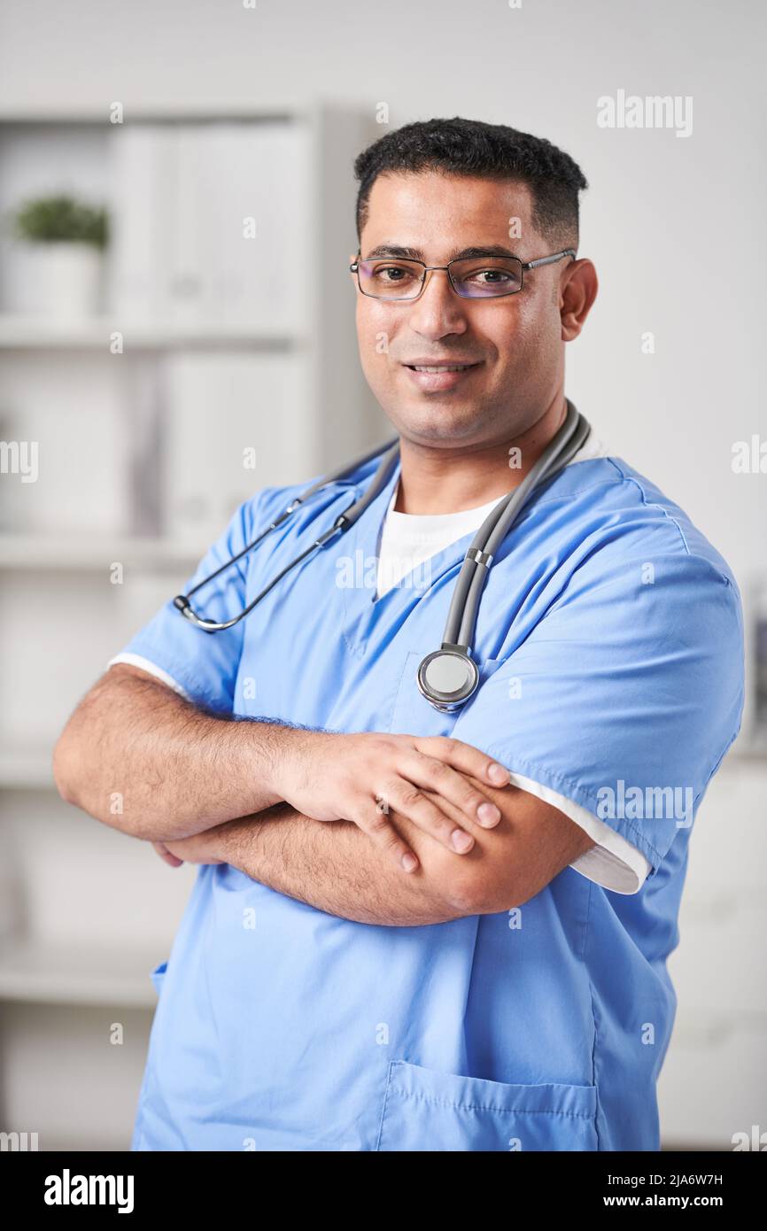 Vertical waist up portrait shot of modern young adult Middle-Eastern ...