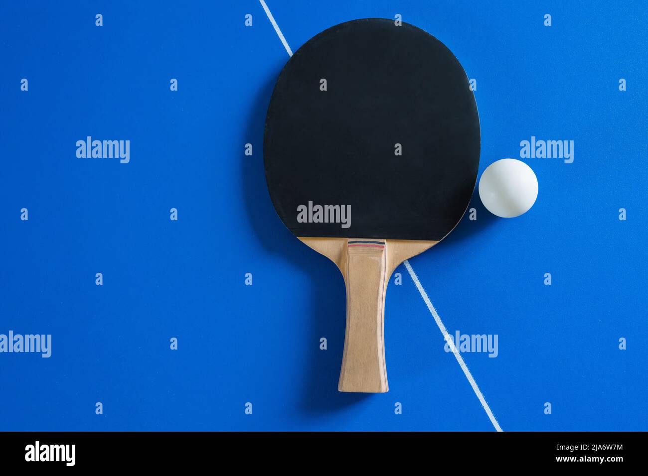 White ping pong ball and racket for playing ping pong. Top view. Sports ...